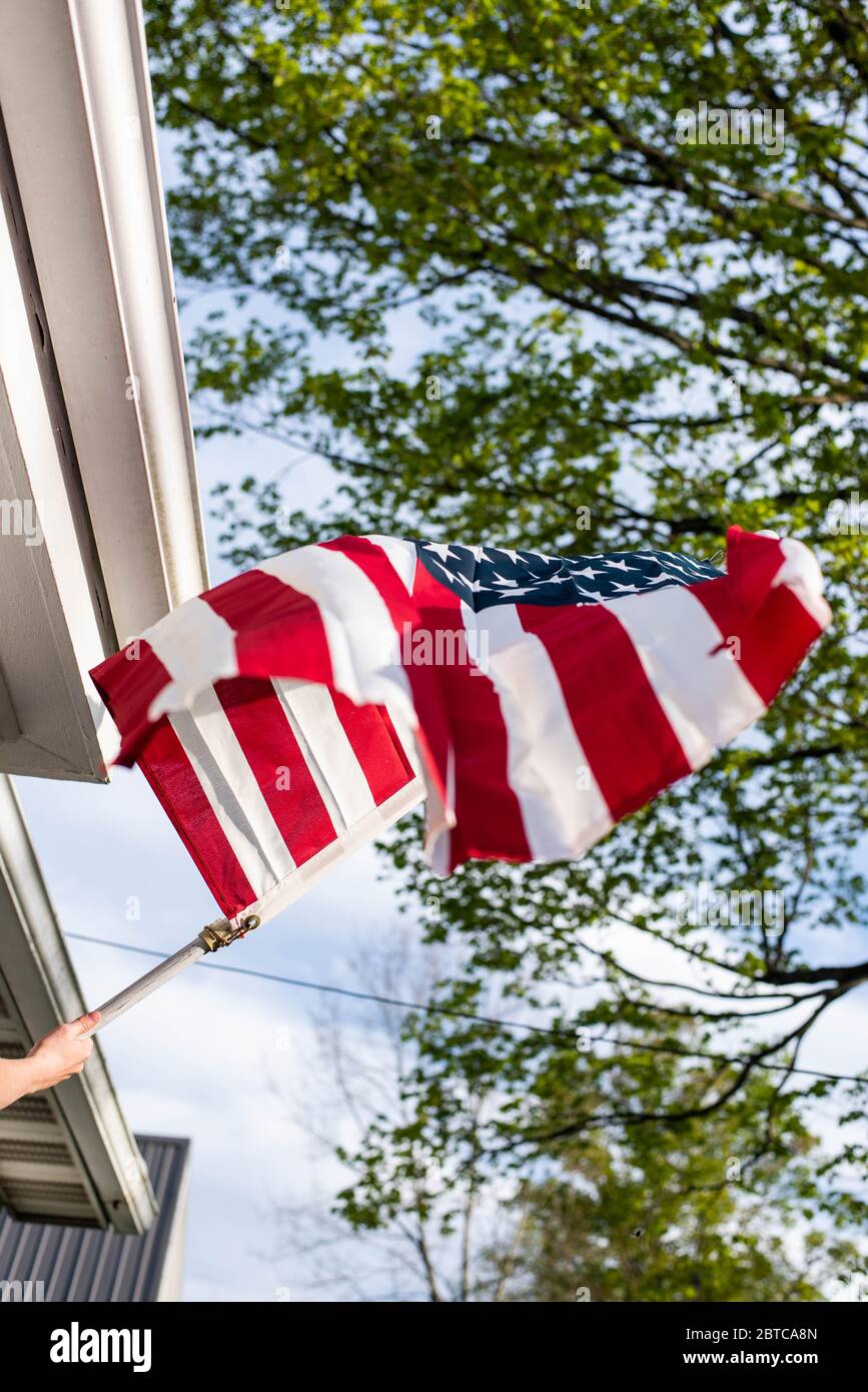 United states flag hangs outside hi-res stock photography and images ...