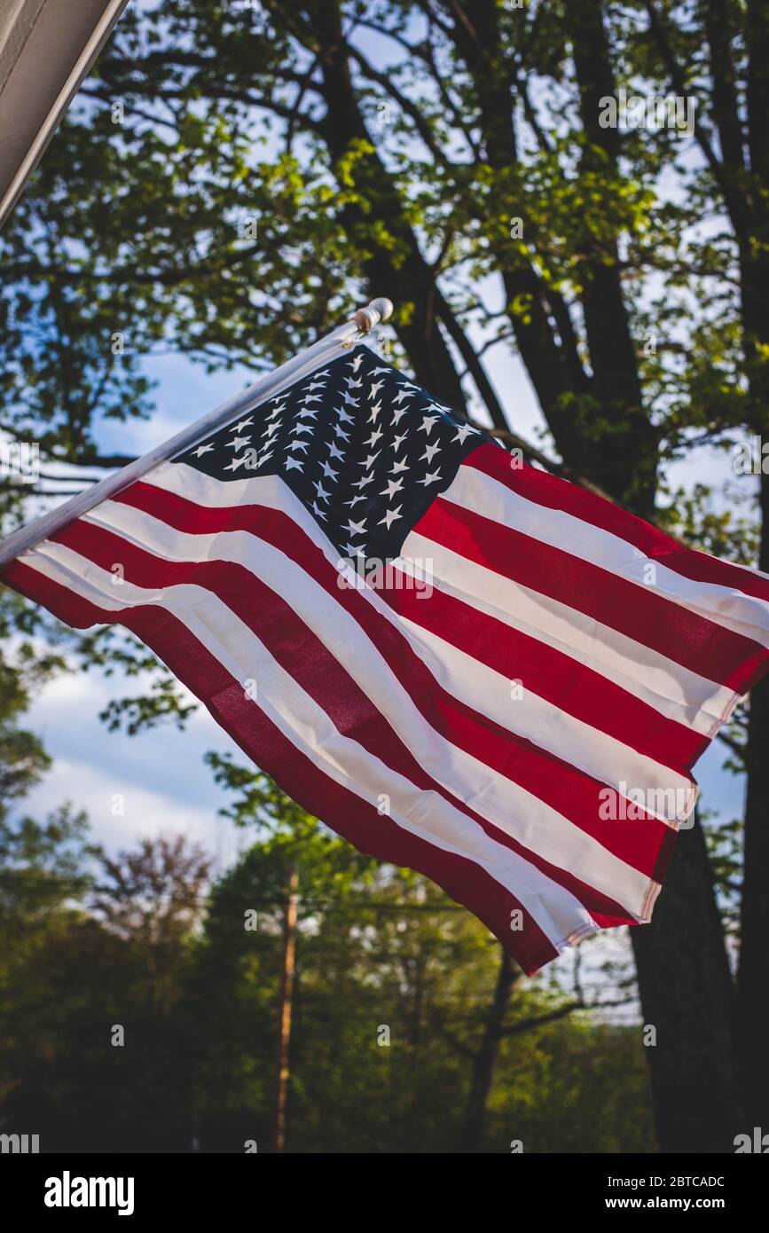 United states flag hangs outside hi-res stock photography and images ...