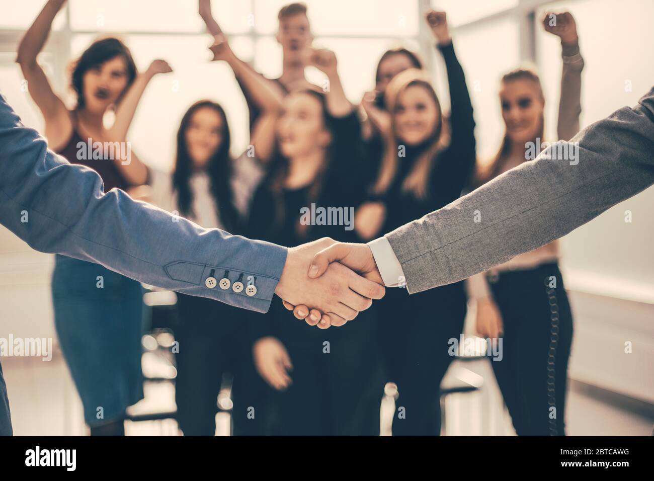 close up. business handshake on a blurred office background Stock Photo ...