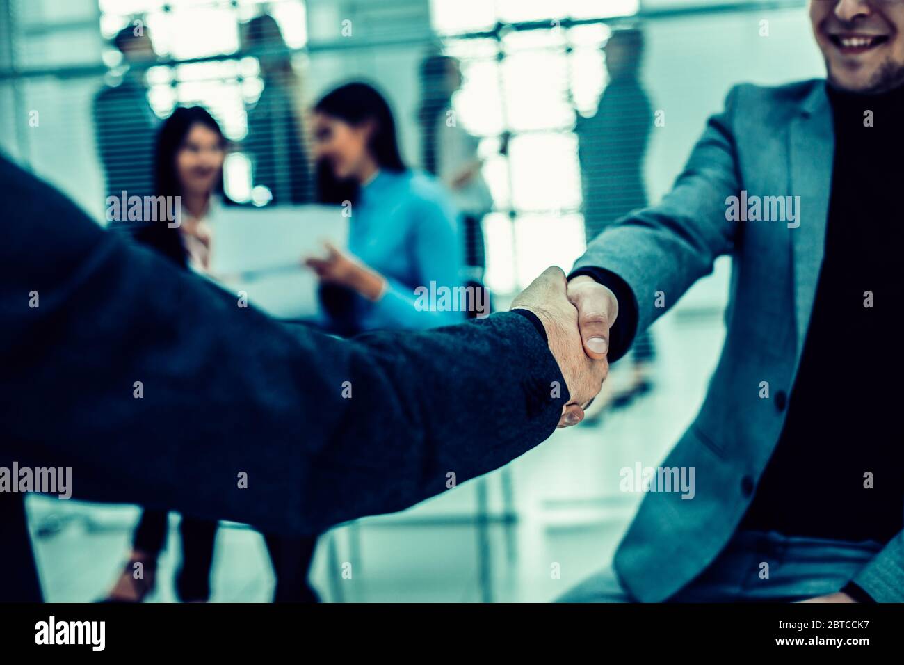 close up. business handshake on office background Stock Photo - Alamy