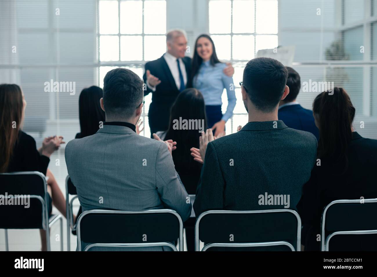 boss and business team congratulating the best employee with applause ...