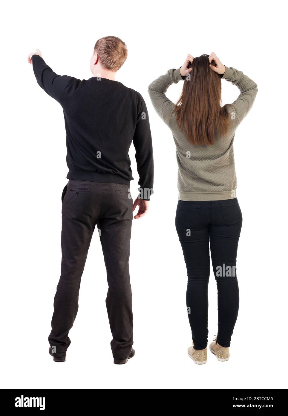 Back view of couple in sweater with mobile phone. beautiful friendly ...