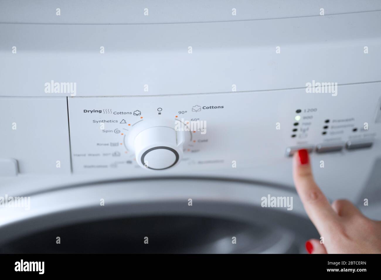 Start button on washing machine hi-res stock photography and images - Alamy