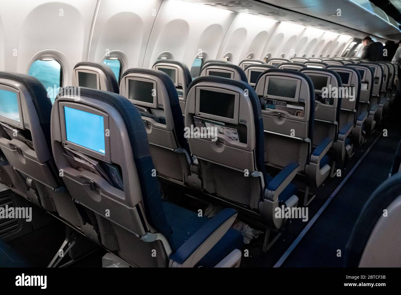 The interior of the aircraft. Empty airplane cabin. Rows of passenger ...