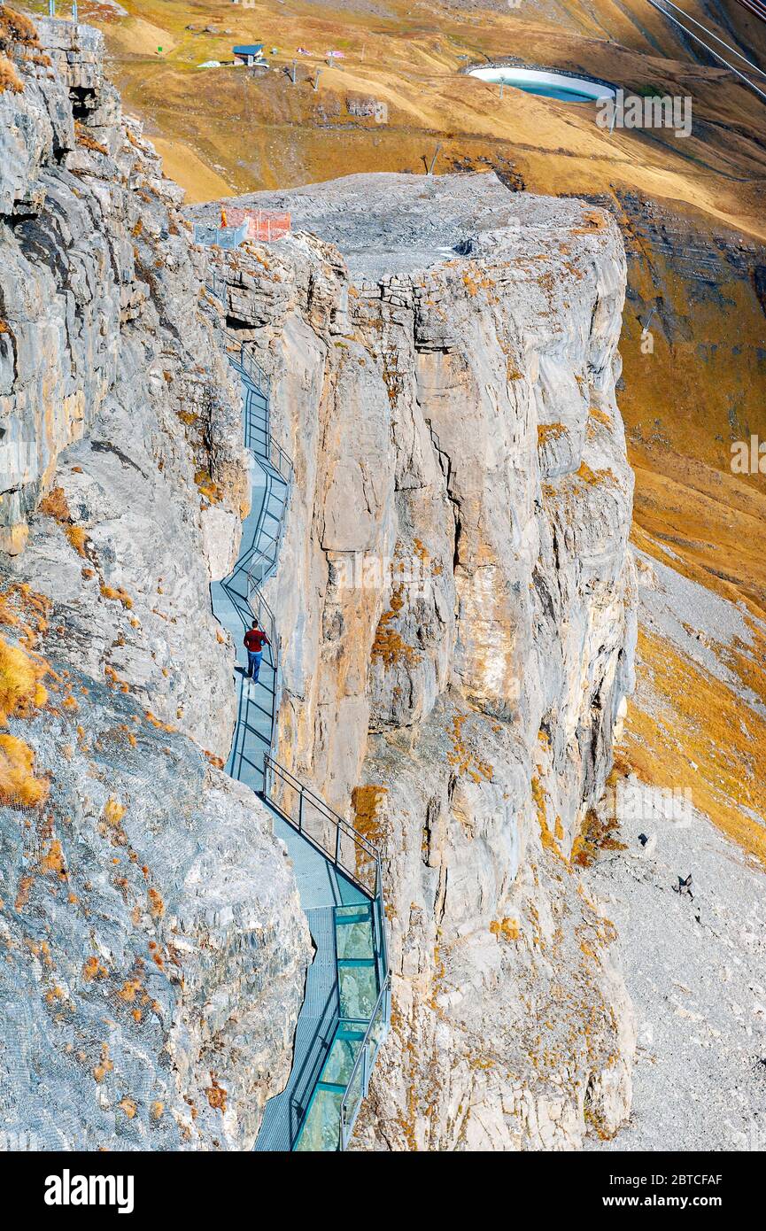 Tourists walking on the Thrill Walk, the cliff pathway located under ...