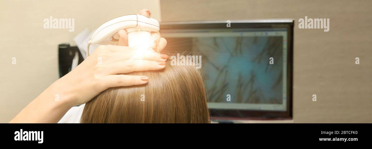 Woman check head hair in clinic Stock Photo - Alamy