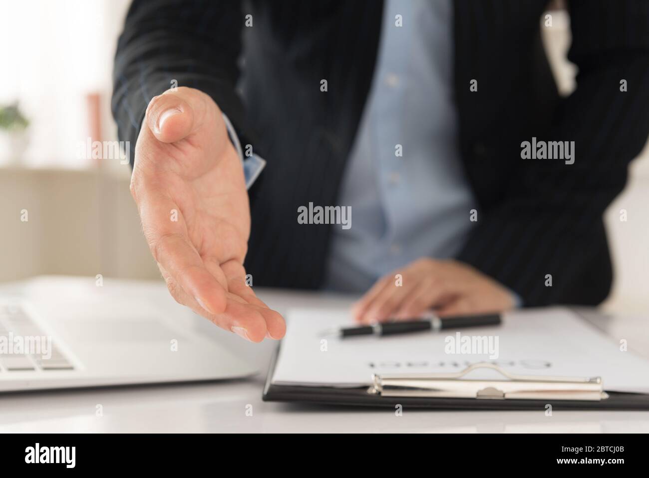 Business people giving him hand for handshake to partner. Concept of ...