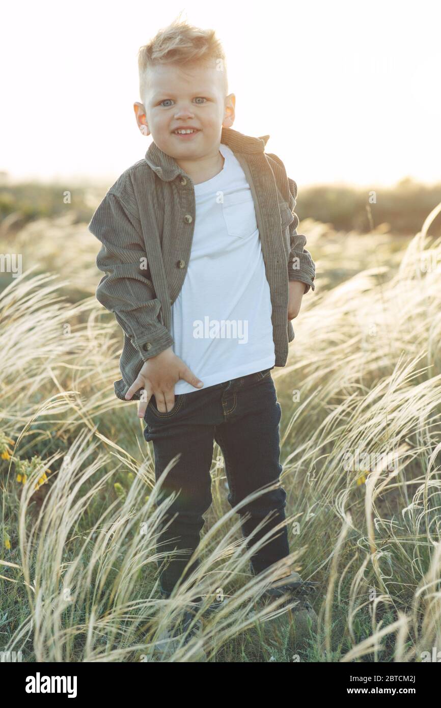 Little kid boy in nature Stock Photo - Alamy