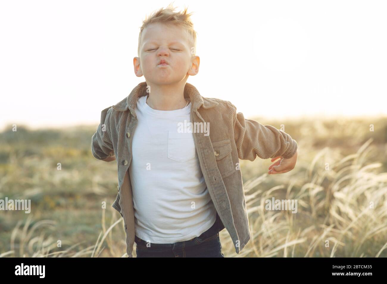 Little kid boy in nature Stock Photo - Alamy