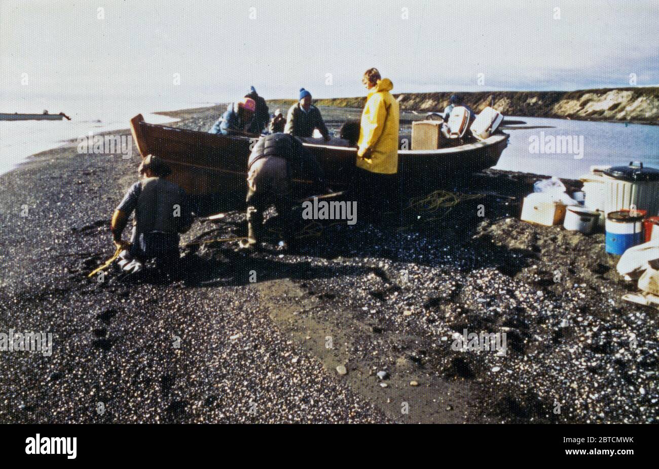 Eskimo family portaging boat and camp gear at Anygaak, at the mouth of ...