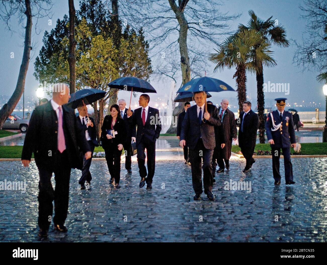 President Barack Obama and members of his staff arrive for a reception ...