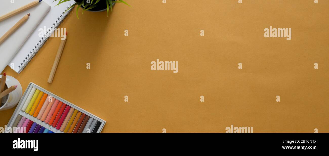 Top view of simple workspace with copy space, computer device, coloured ...