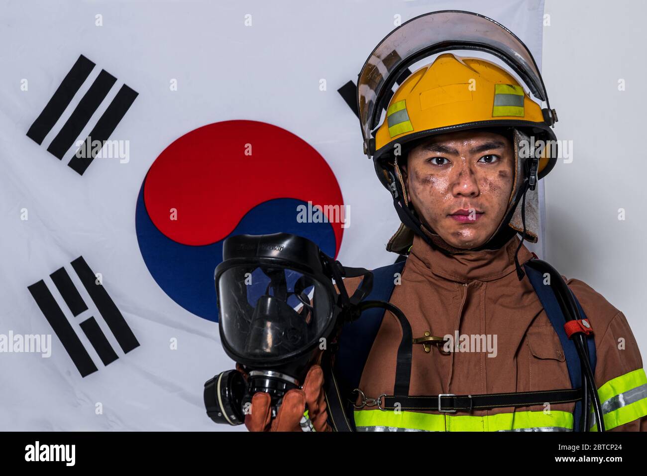 Asian male and female firefighter portrait, young smiling fireman in ...