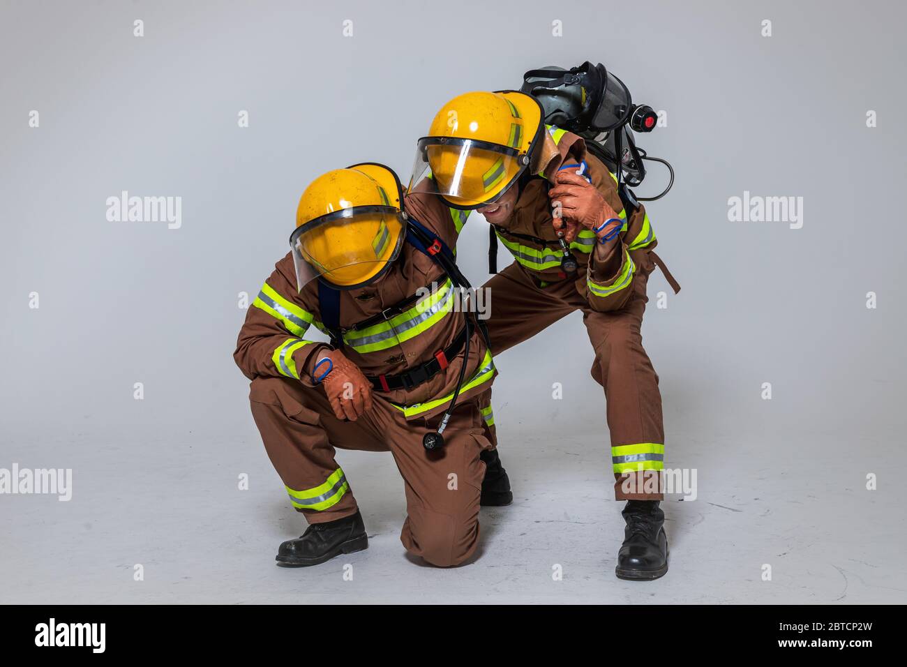 Asian male and female firefighter portrait, young smiling fireman in ...