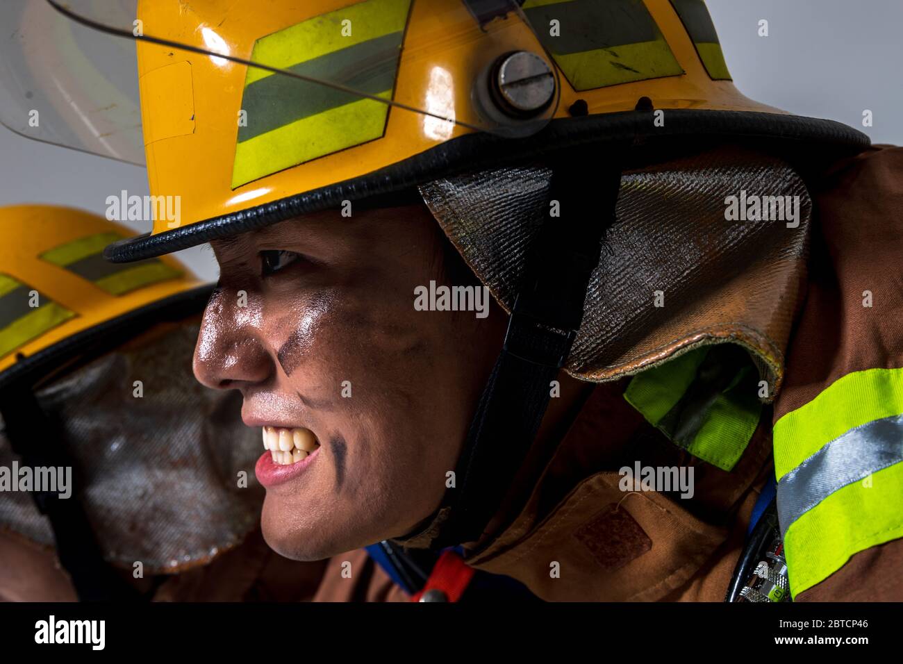 Asian male and female firefighter portrait, young smiling fireman in ...