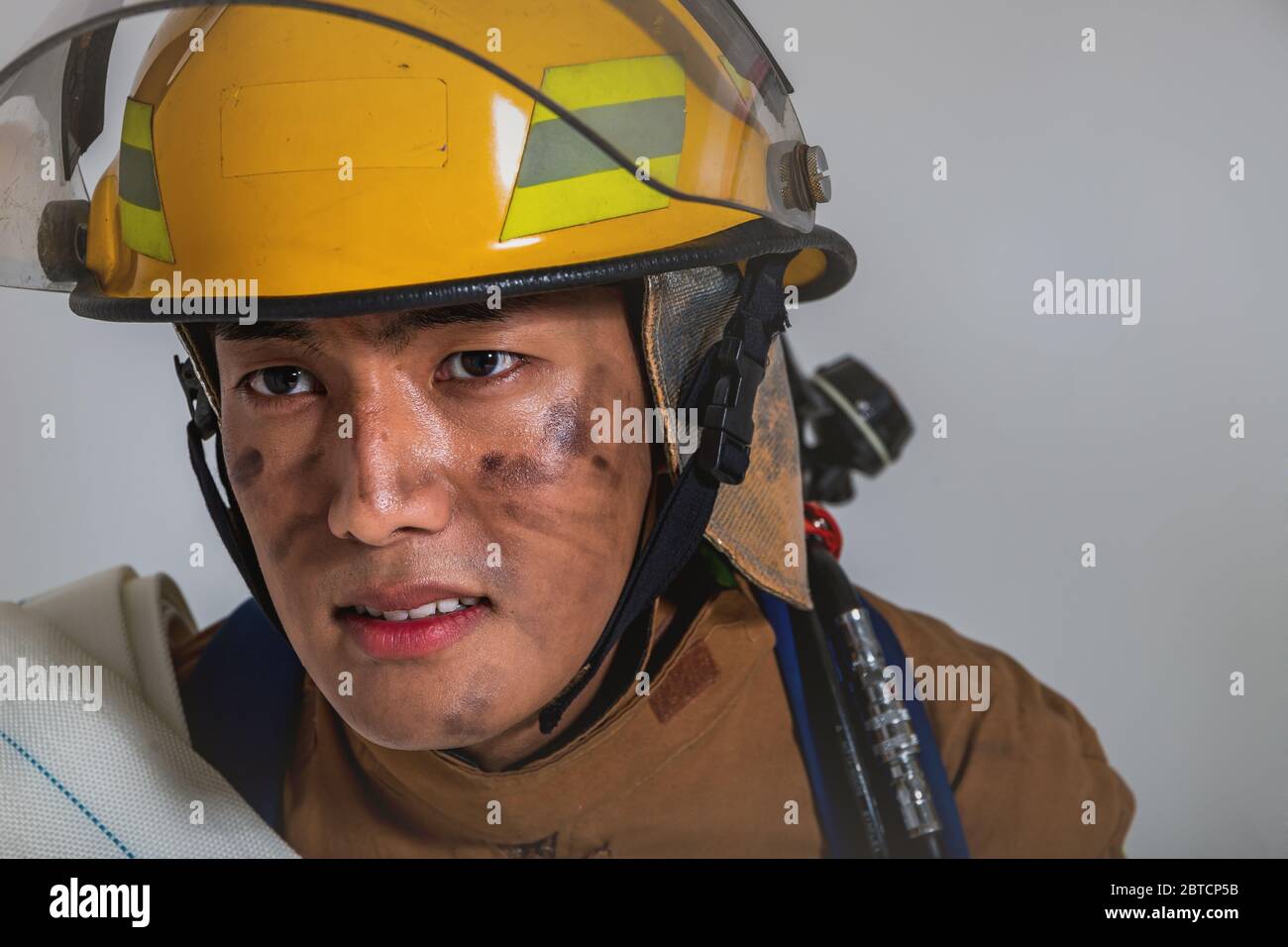 Asian male and female firefighter portrait, young smiling fireman in ...
