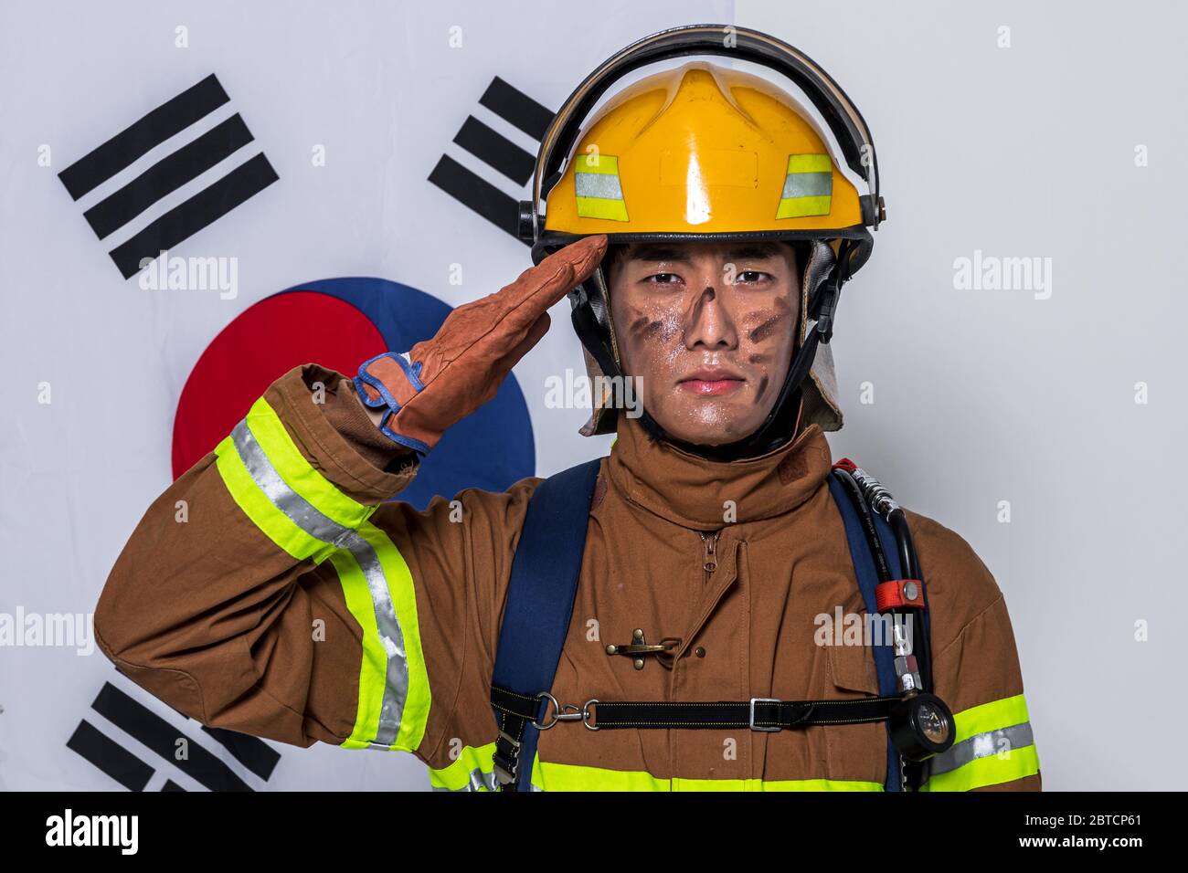 Firefighter helmet salute hi-res stock photography and images - Alamy