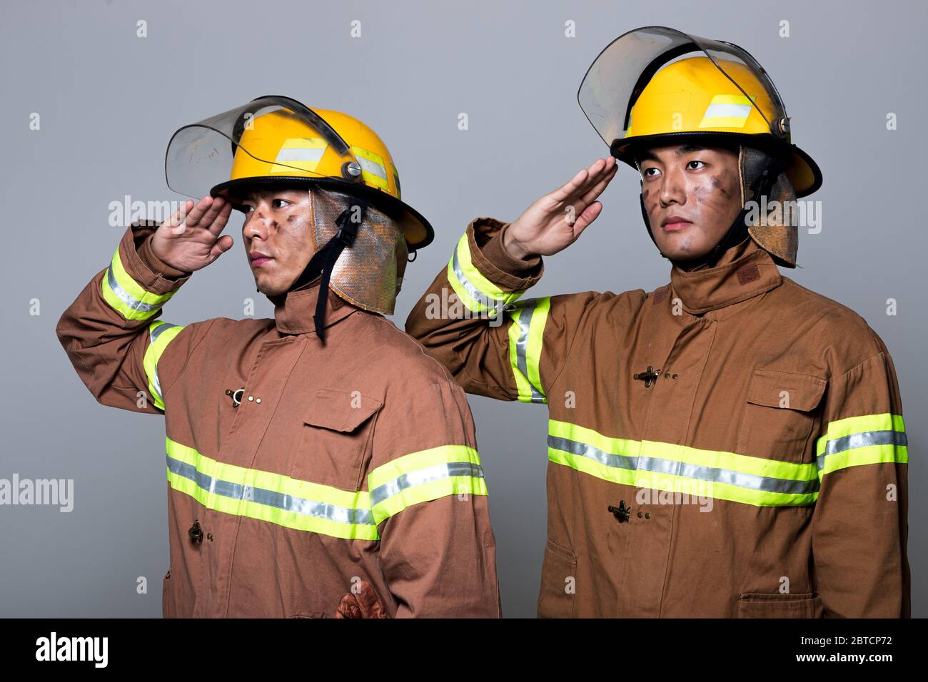 Firefighter helmet salute hi-res stock photography and images - Alamy