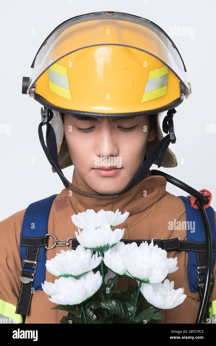 Asian male and female firefighter portrait, young smiling fireman in ...