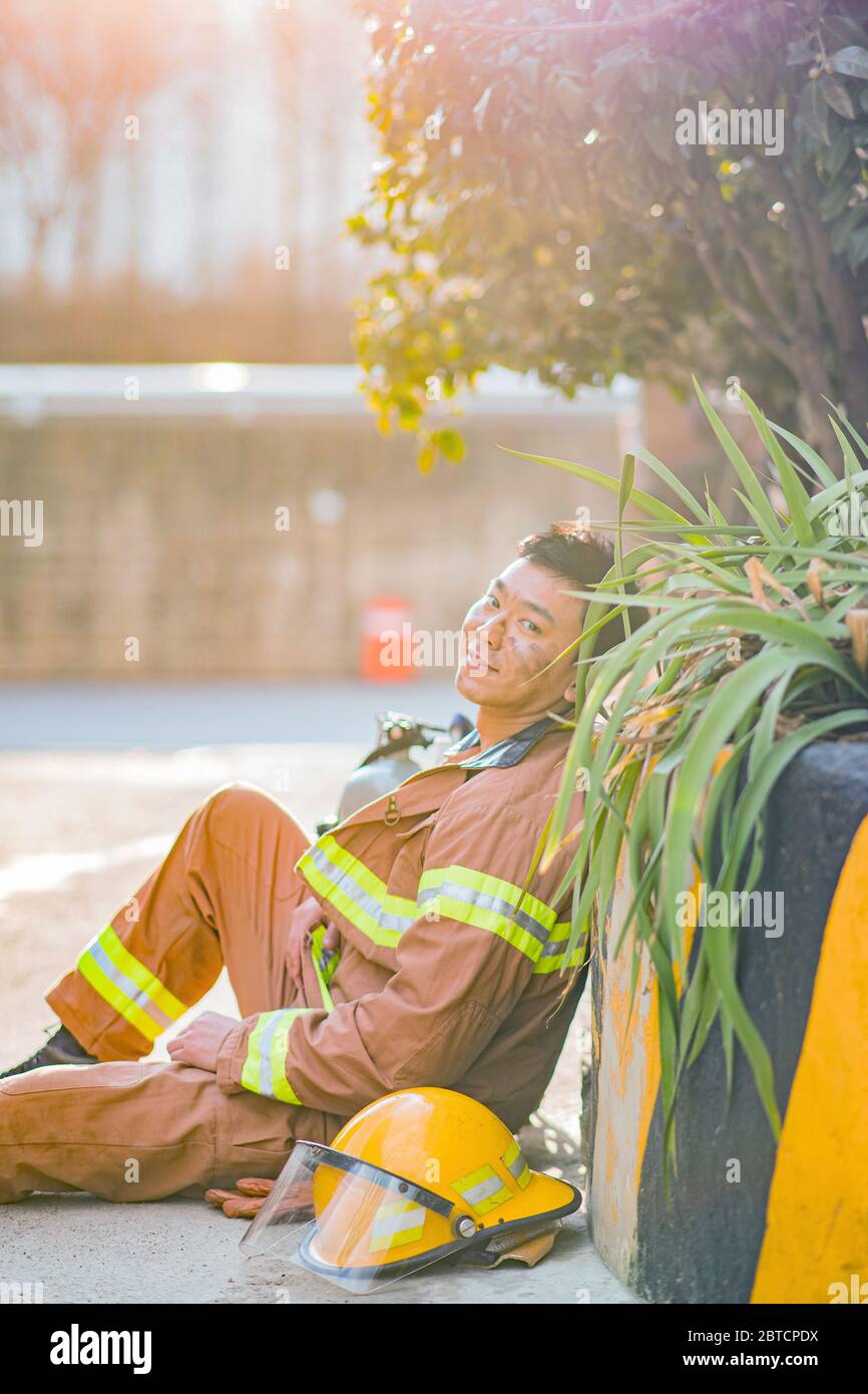 Asian male and female firefighter portrait, young smiling fireman in ...