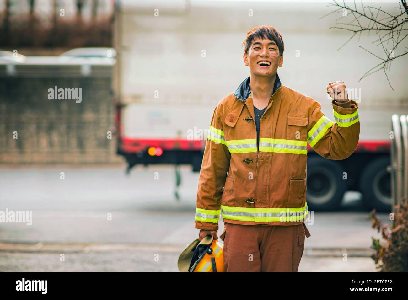 Asian male and female firefighter portrait, young smiling fireman in ...