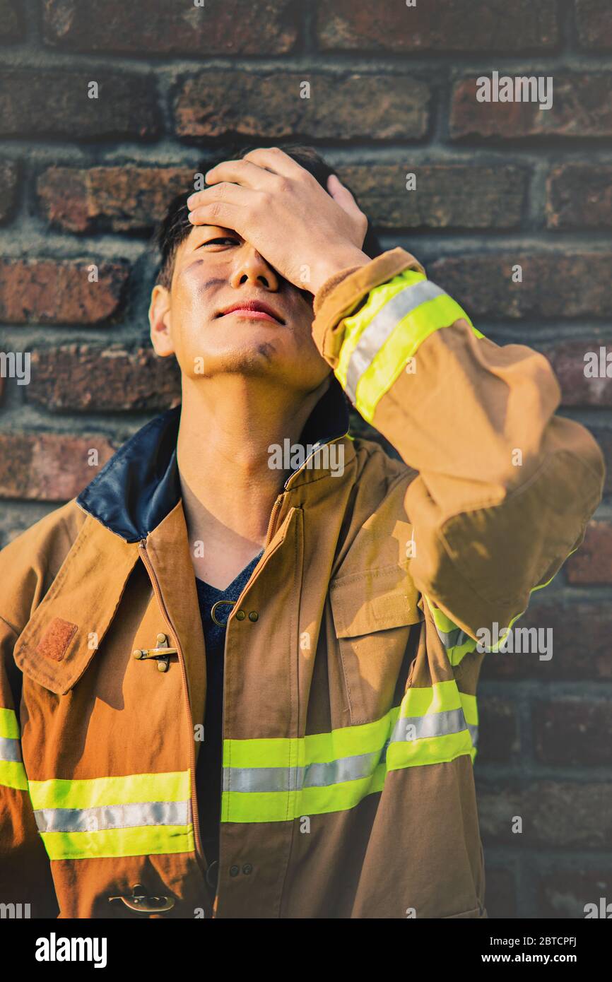 Asian male and female firefighter portrait, young smiling fireman in ...