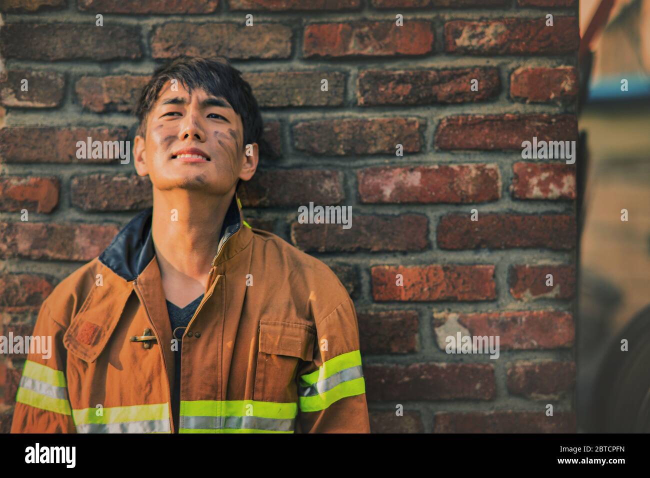 Asian male and female firefighter portrait, young smiling fireman in ...