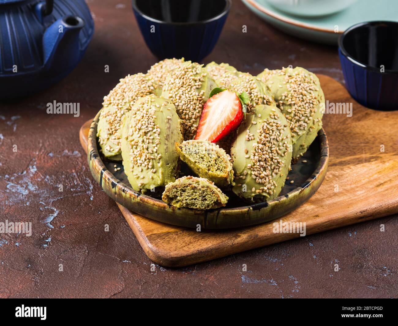 Matcha madeleine cookies with chocolate frosting Stock Photo - Alamy