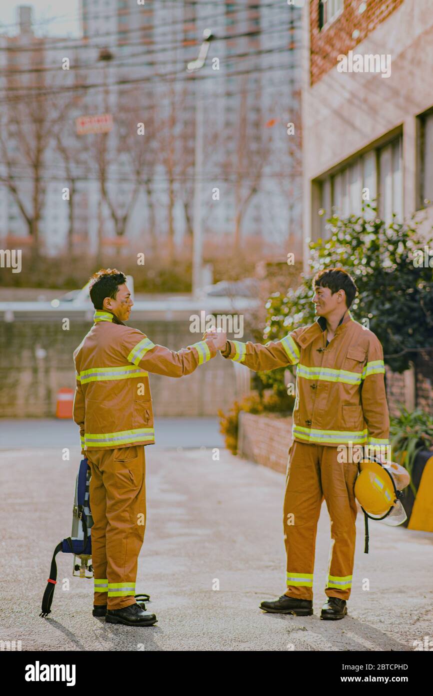 Male firefighter in high hi-res stock photography and images - Alamy
