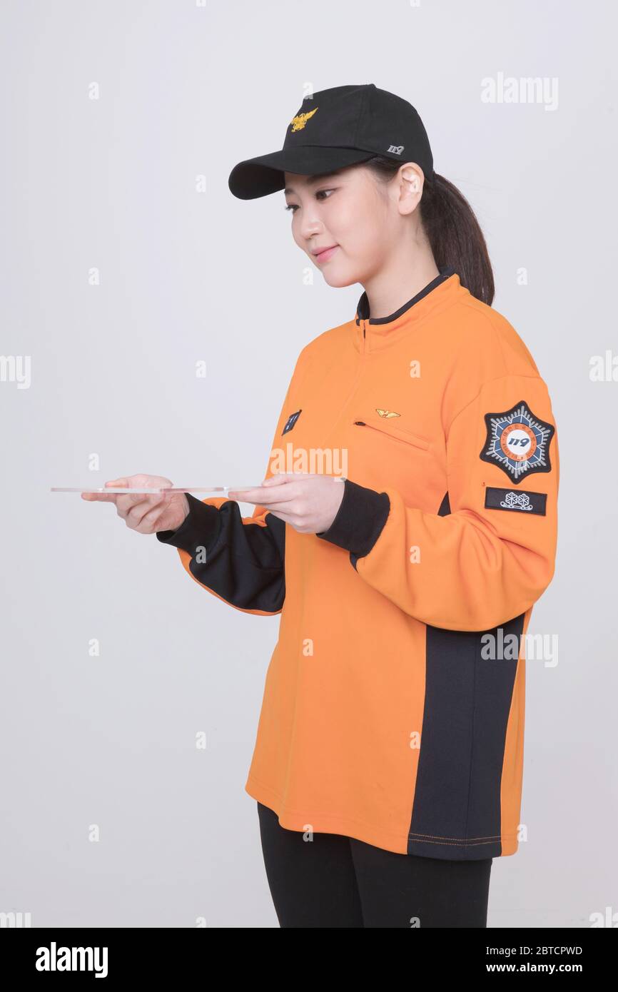 Asian male and female firefighter portrait, young smiling fireman in ...
