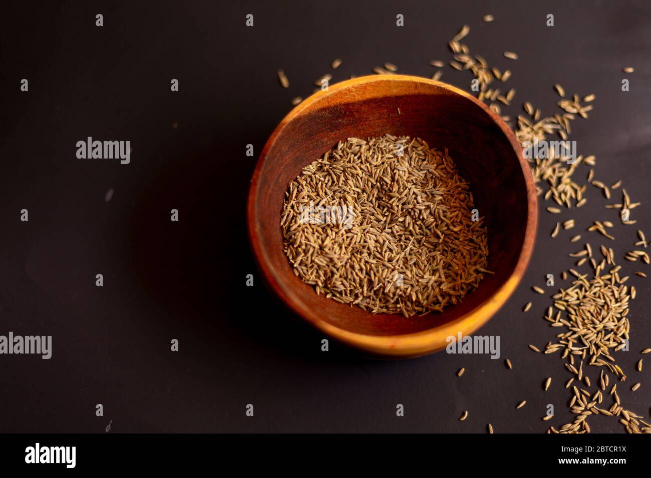 Cumin and spices on rustic wood background hi-res stock photography and ...