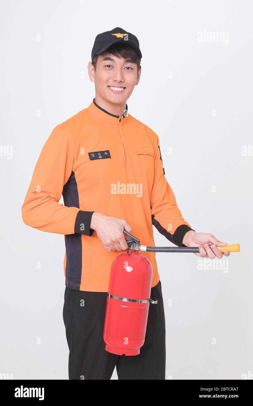 Asian male and female firefighter portrait, young smiling fireman in ...