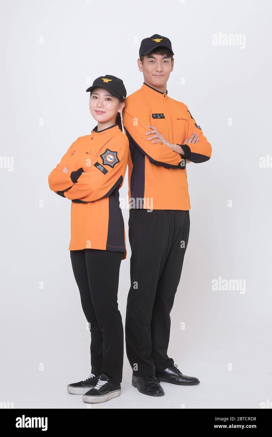 Asian male and female firefighter portrait, young smiling fireman in ...