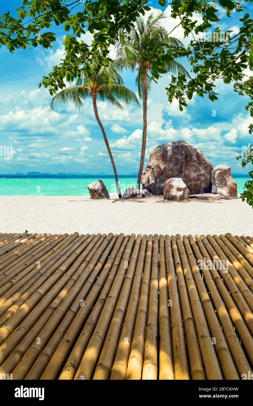 Tropical beach with bamboo deck Stock Photo - Alamy