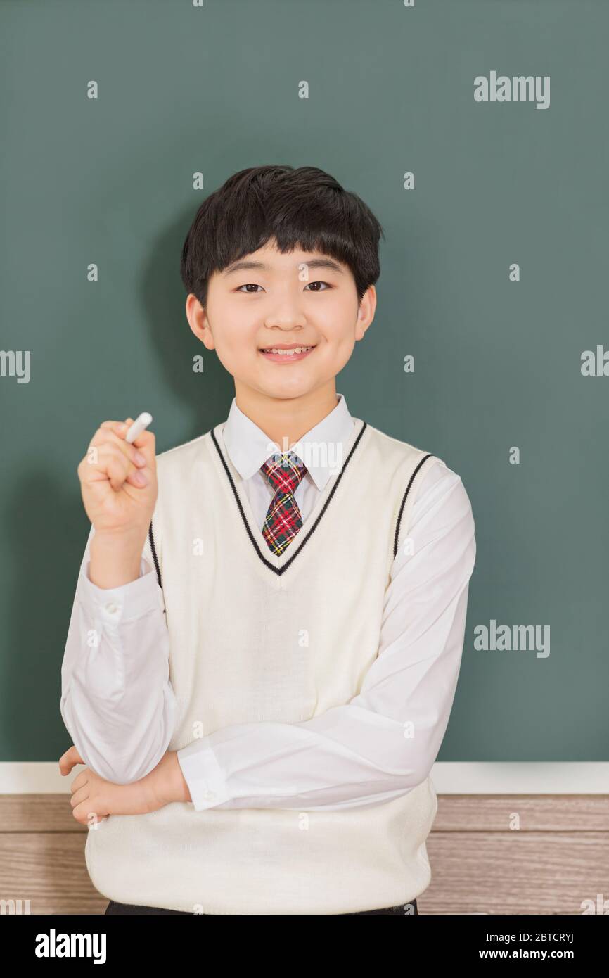 Smart school uniform boy smiling hi-res stock photography and images ...