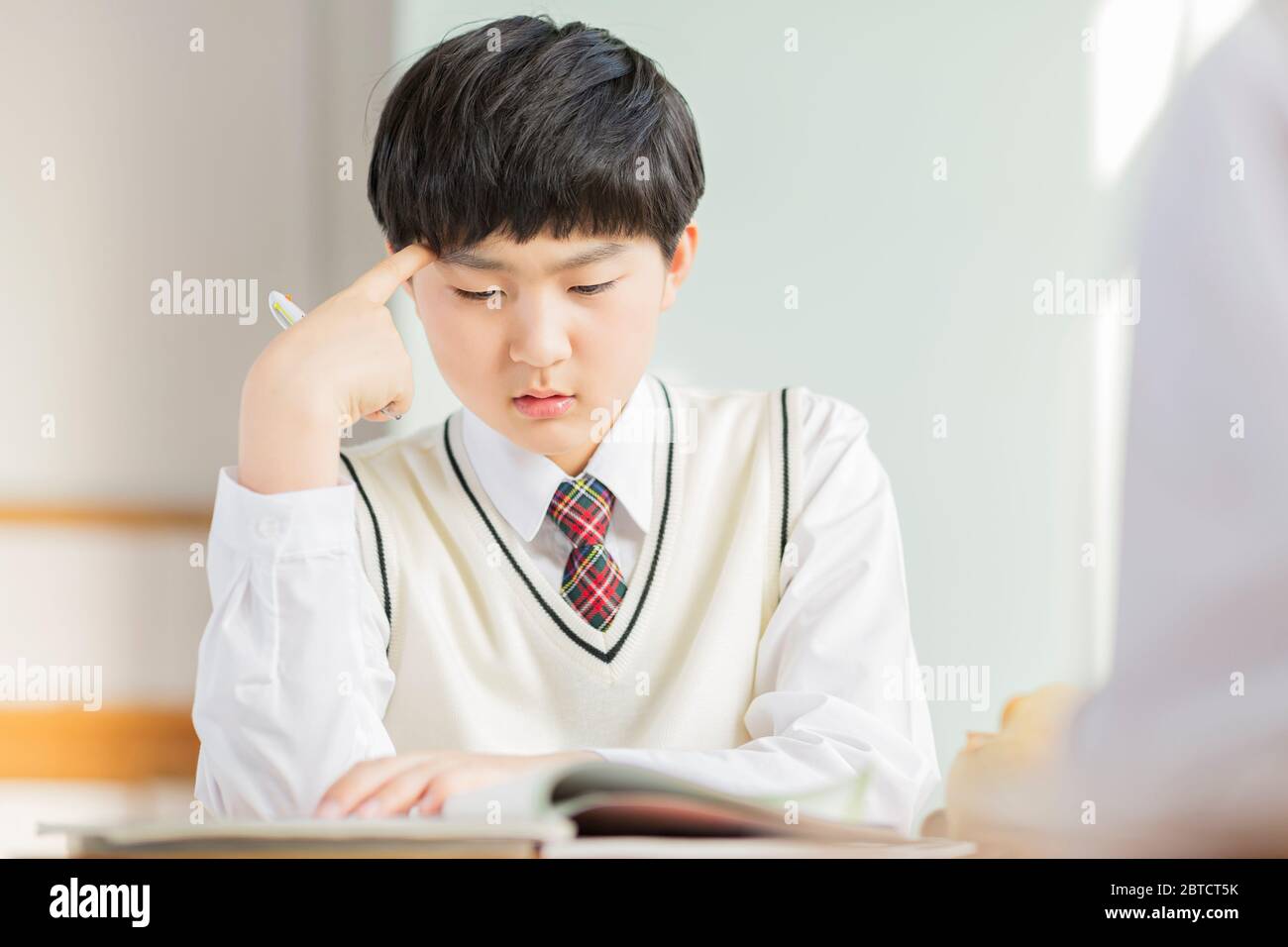 Smart school uniform boy smiling hi-res stock photography and images ...