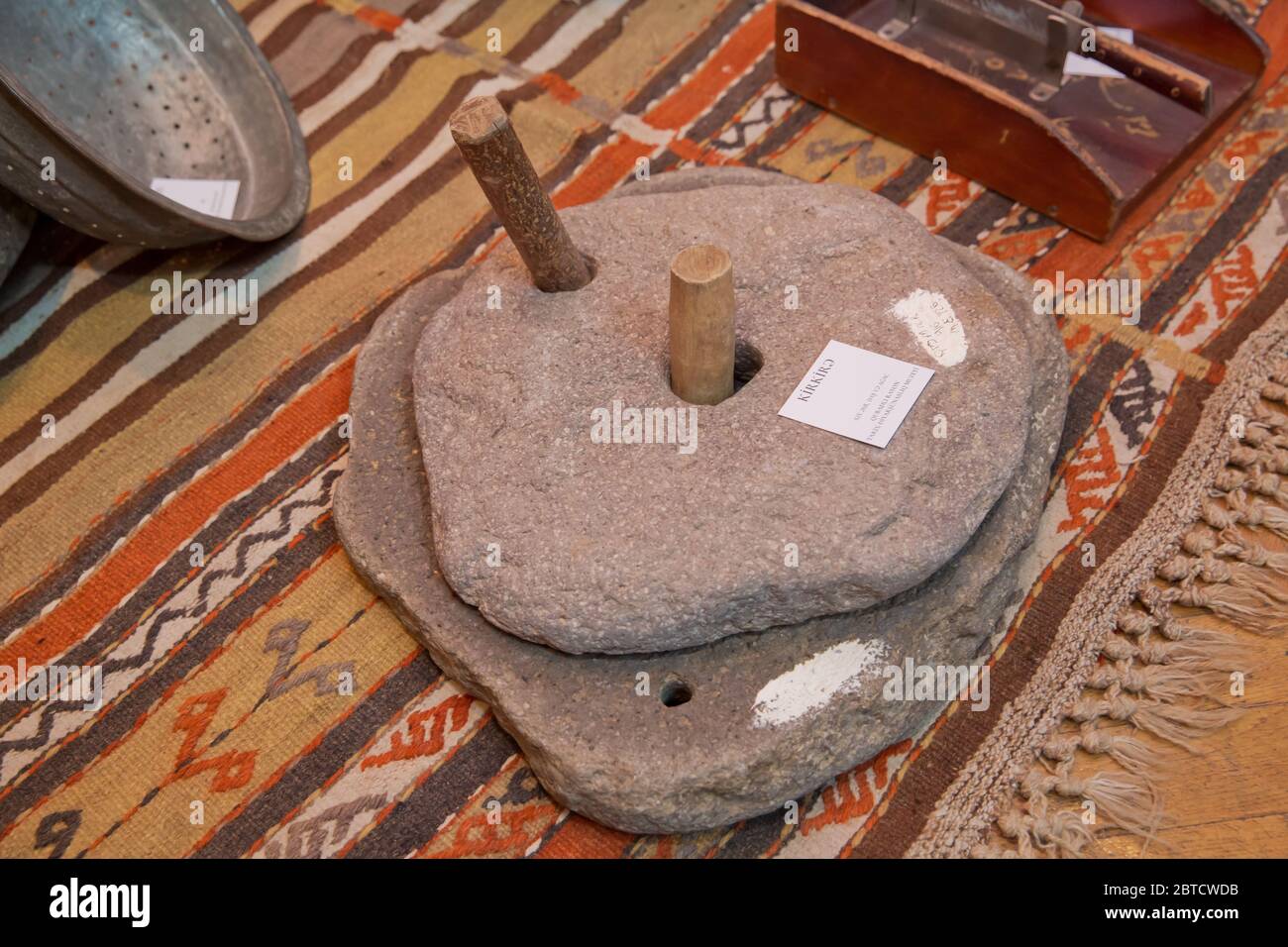 Rotary discoid mill stone for hand-grinding a grain into flour ...