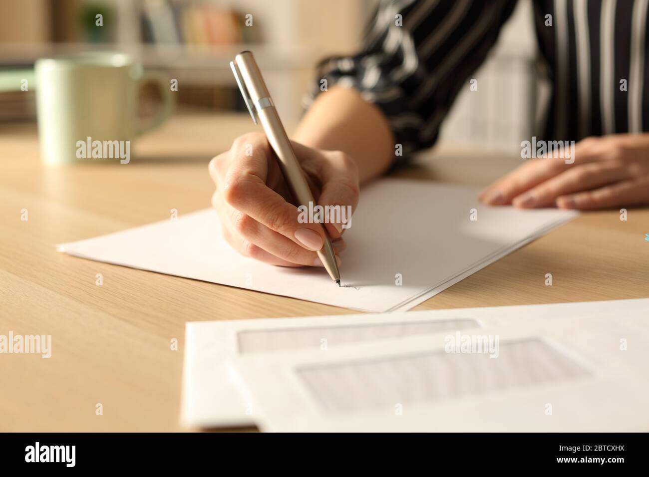 Woman posting letter in post hi-res stock photography and images - Alamy