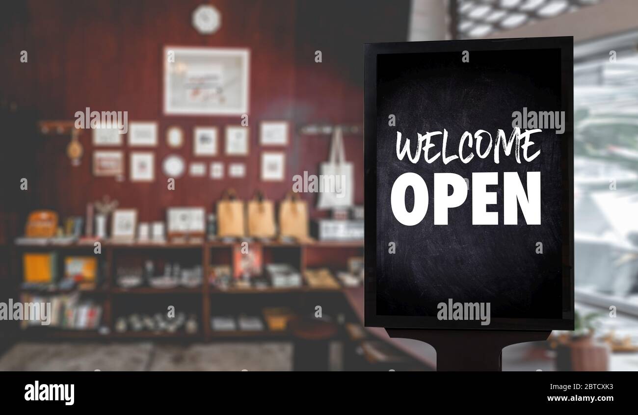 Come in We’re Open’ on cafe waiter standing in front of coffee shop ...