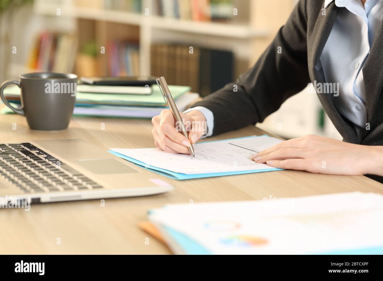 Close up of self employed woman hands filling out checkbox form sitting ...