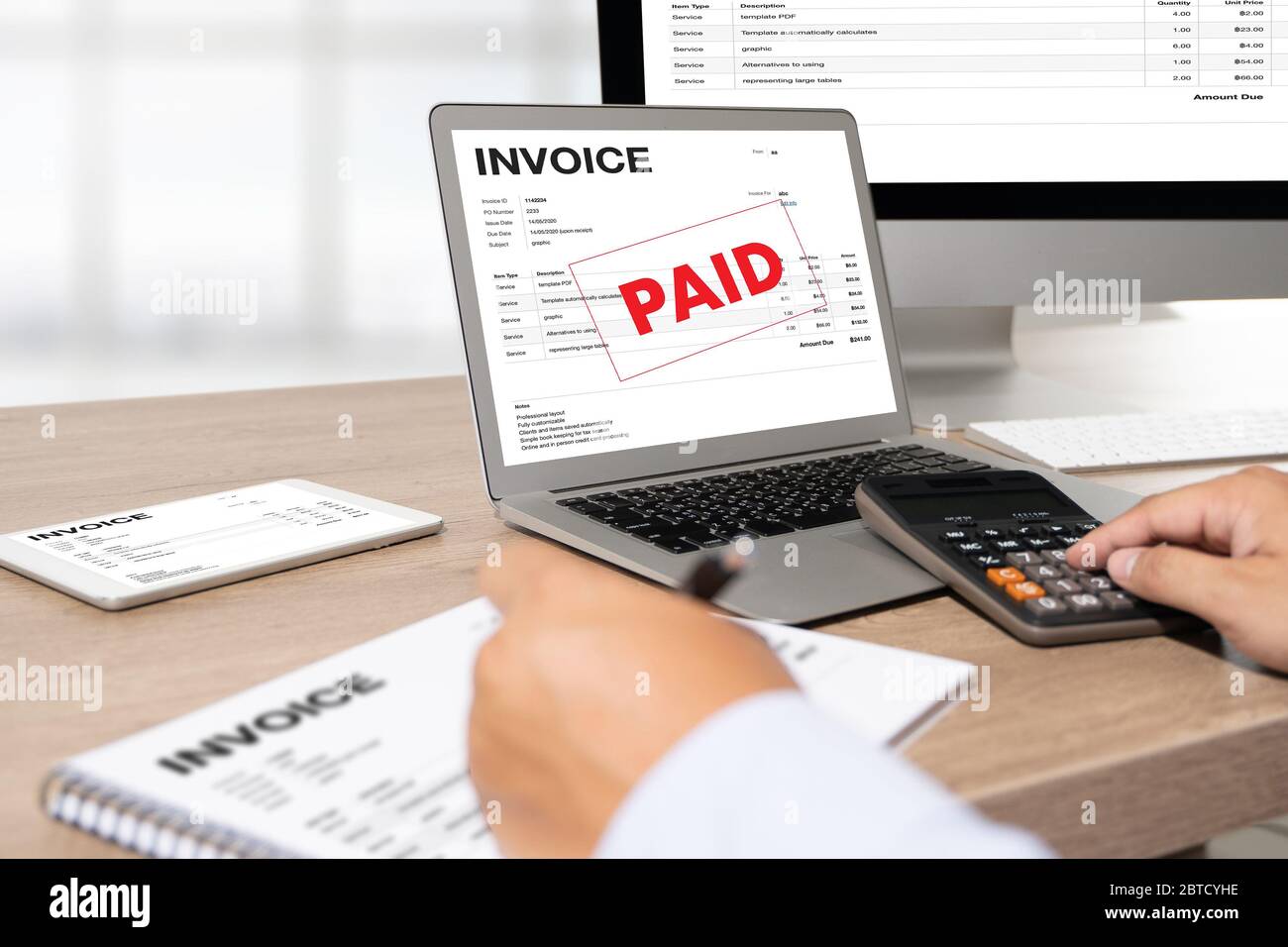 Businessman work Using The Computer Calculating Invoice In Office ...