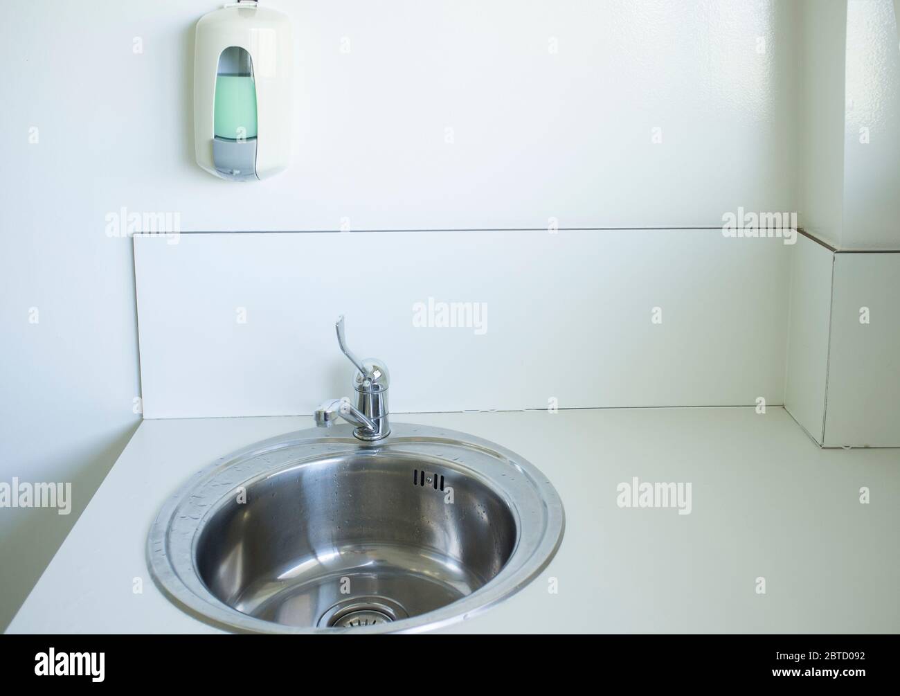 Wash corner at healthcare center hallway. Hygiene habits concept during ...