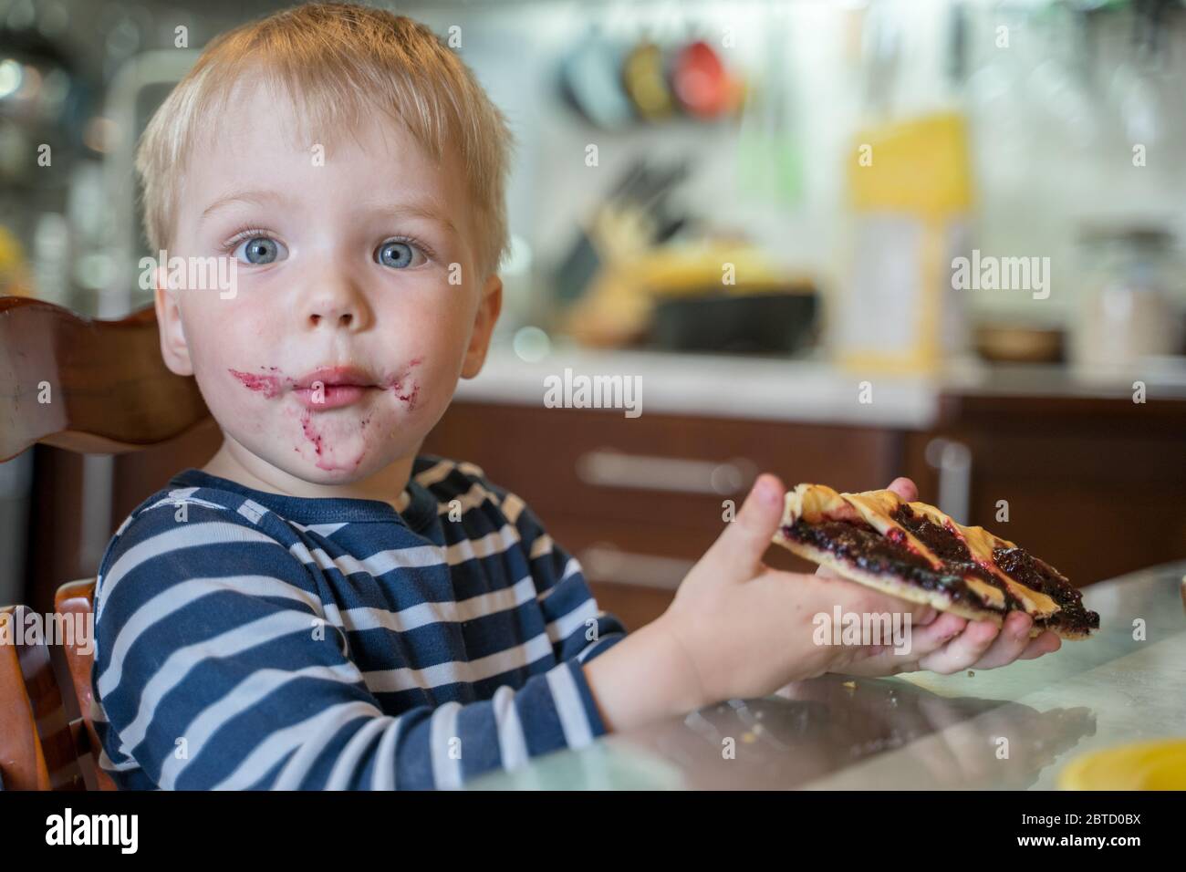 Little cute blond boy bully without permission of his mother broke off ...