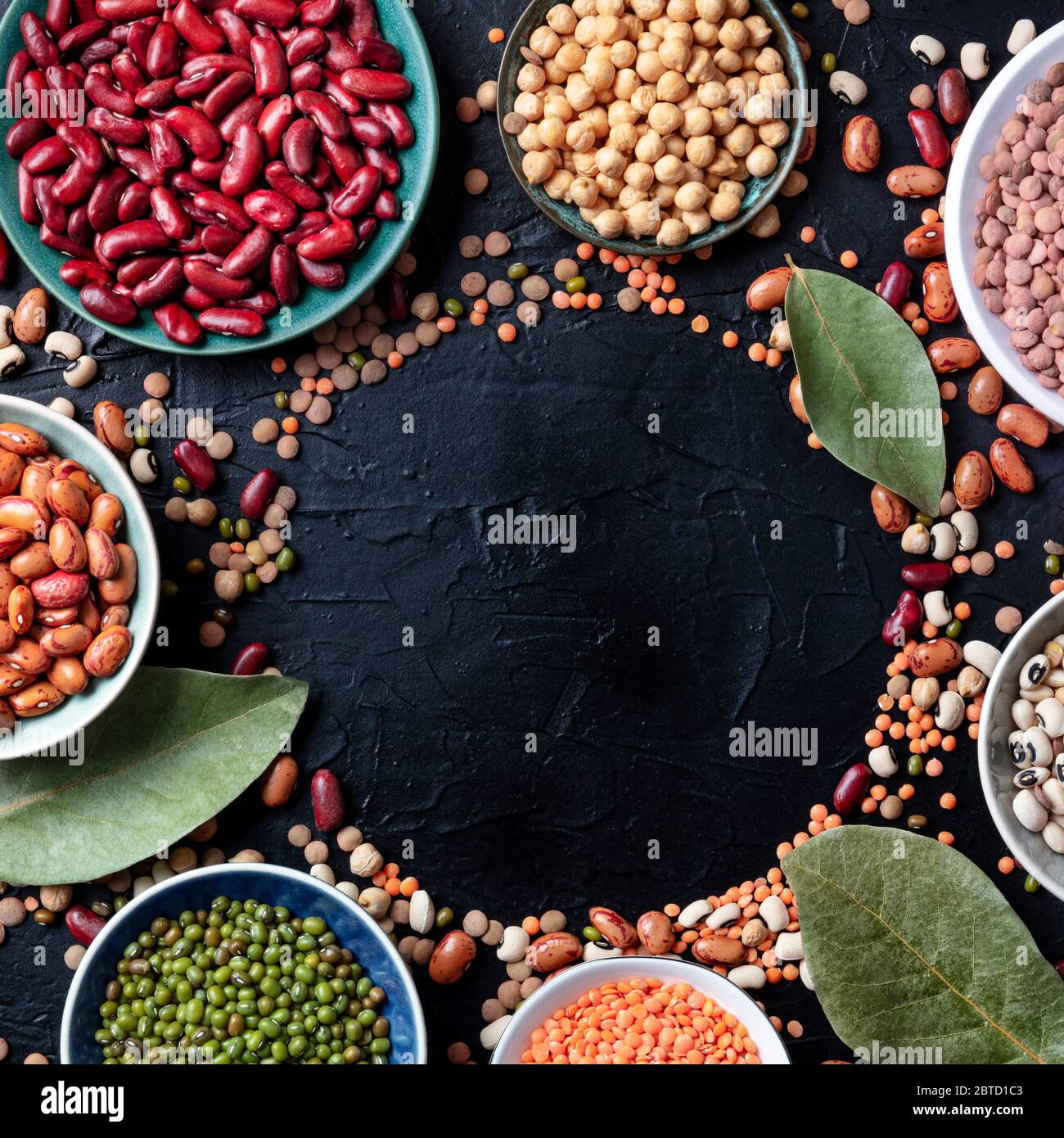 Legumes, top shot on a dark background with copy space. Lentils ...