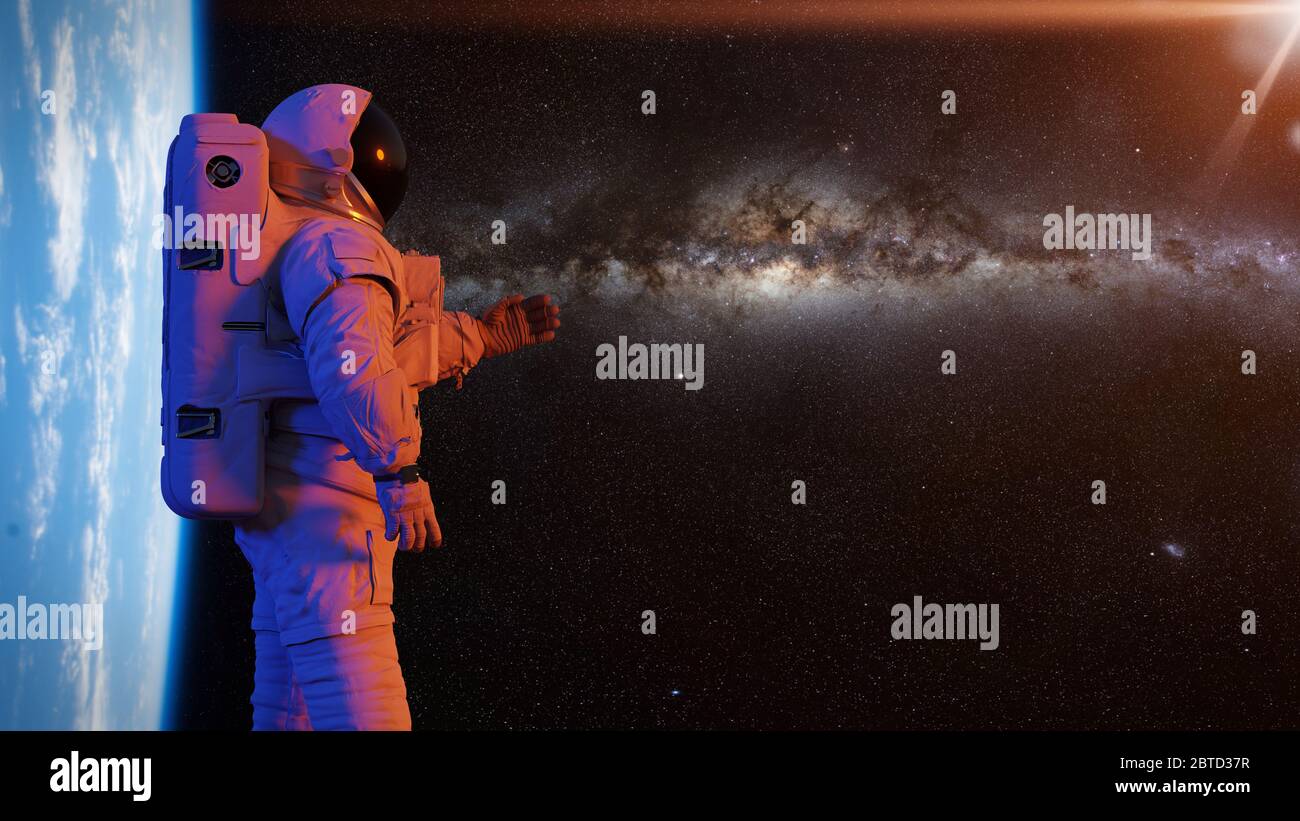 astronaut presenting an empty space in front of planet Earth and the ...