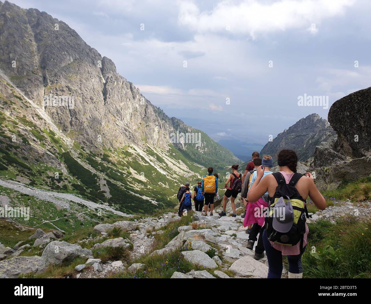 Young woman tourist hiking mountains hi-res stock photography and ...
