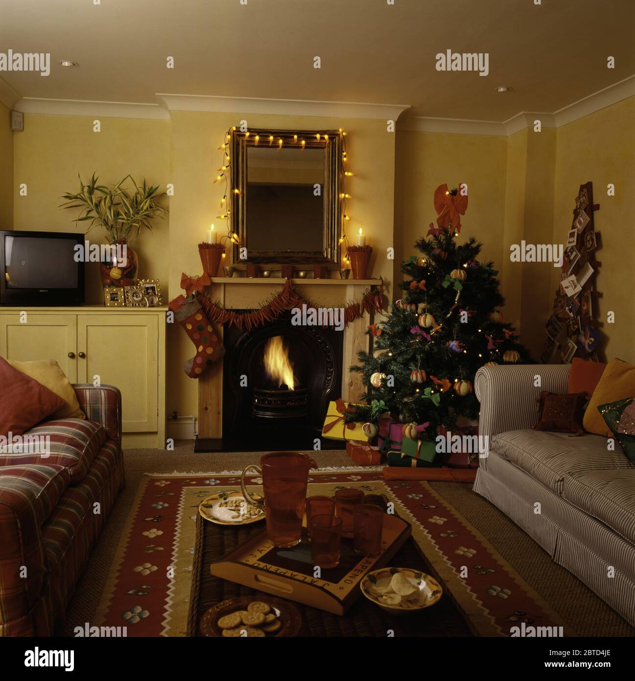 Christmas tree in living room decorated for Christmas Stock Photo - Alamy