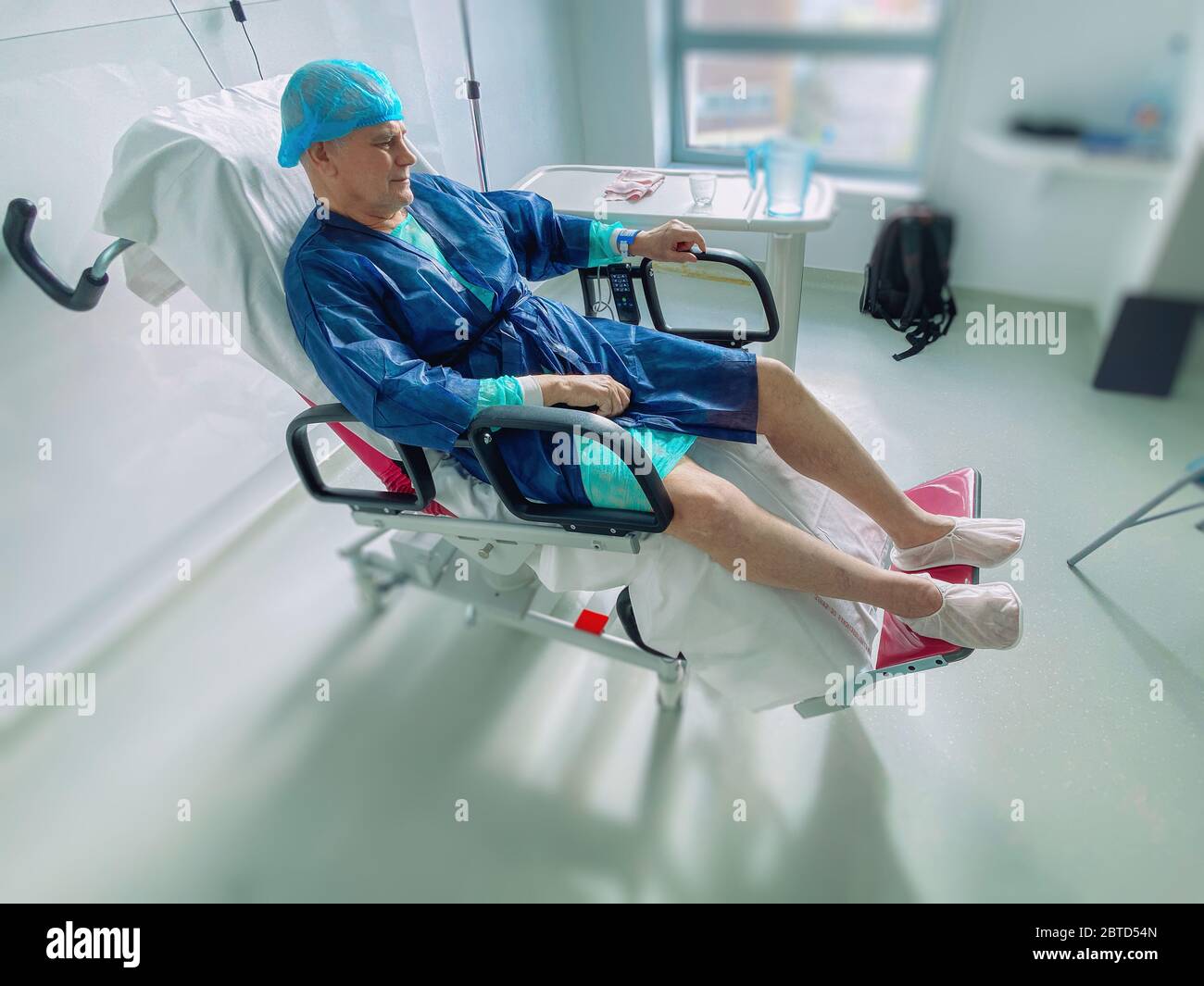 Happy smiling senior man - elevated view of lying on the medical chair ...
