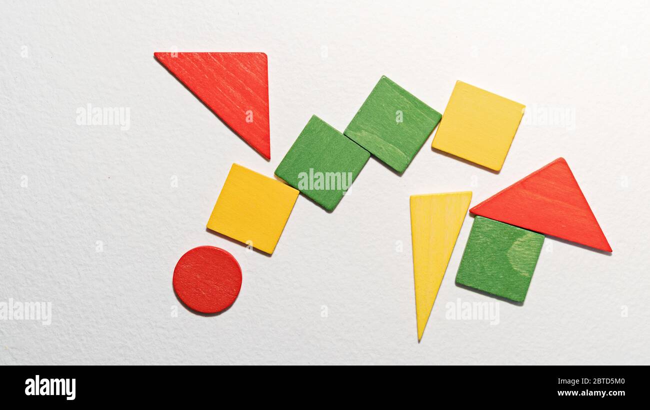 Different colorful shapes wooden on white background. Geometric shapes ...