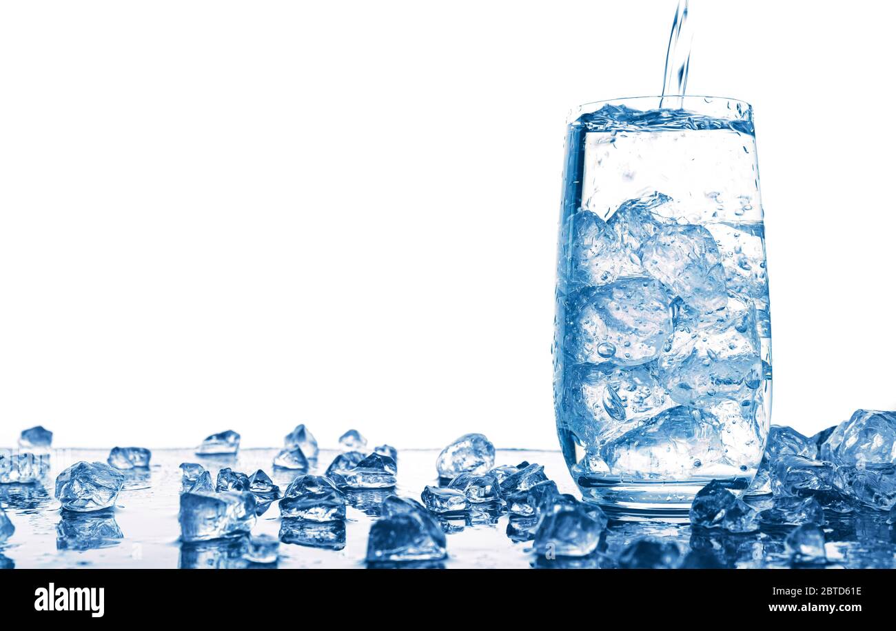 Pouring water into glass with ice isolated on white background Stock ...